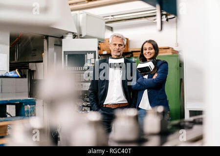 Young man wearing glasses over yellow background looking at the camera ...