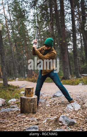 Man chopping wood Stock Photo - Alamy