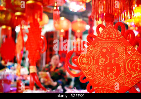 People select Spring Festival decorations at a market in Beijing, China ...