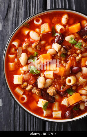 Portion of homemade tomato soup in bowl placed on wooden table Stock ...