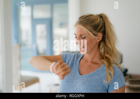 Woman controlling time Stock Photo - Alamy
