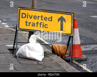 Diverted traffic sign. Road sign showing a diversion all the way around ...