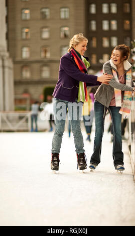 Happy friends are having fun with skates and longboards at straight ...