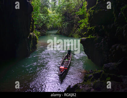 Tourist at Lussok Cave and underground river, Luna, Apayao, Luzon ...