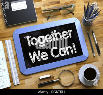 Team, together we can achieve more is standing on wooden cubes ...