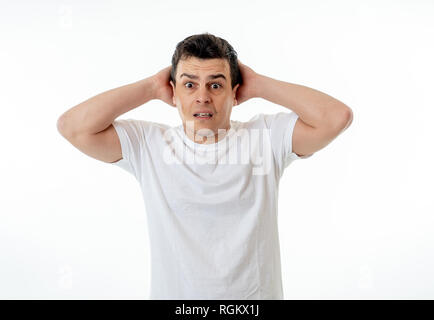 The surprised and astonished young man screaming with open mouth ...