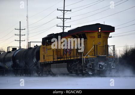 Geneva, Illinois, USA. A helper locomotive cut in mid train helps to ...