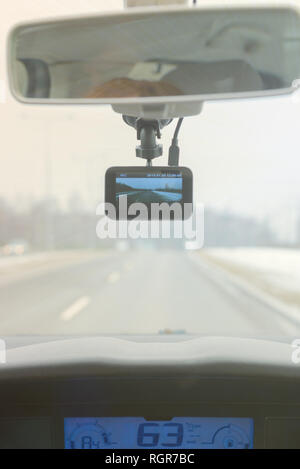 Using dashboard camera to continuously record a view through a vehicle ...