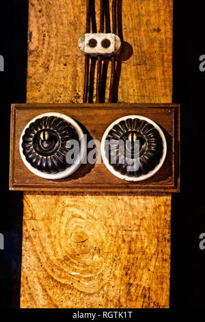 An old fashioned light switch mounted on a white wall Stock Photo - Alamy