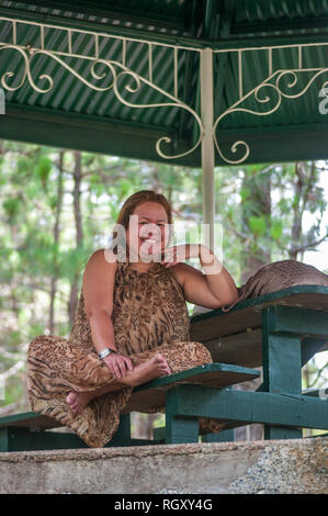 Portrait woman with umbrella at table Stock Photo - Alamy