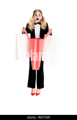 Funny clown with shopping bags isolated on white background Stock Photo ...
