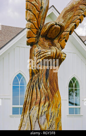 A wooden angel, carved from a tree damaged by Hurricane Katrina, stands ...