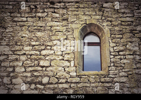 Traditional ancient gothic style window. Old vintage window on stone ...