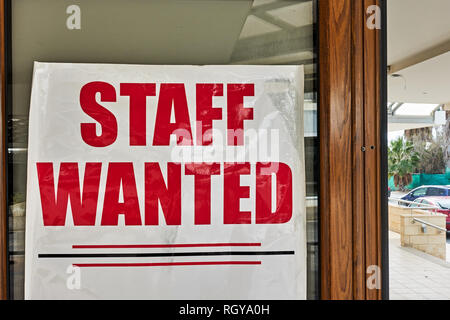 Advertisement for a job vacancy in a shop window Stock Photo - Alamy