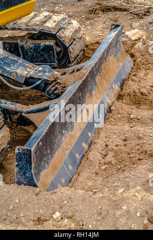 Excavator with grader blade in Utah Valley Stock Photo - Alamy