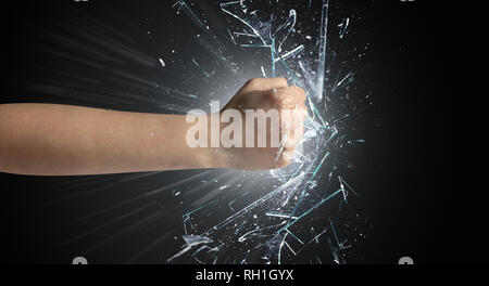Big hand hits intense and breaks a crass stonewall Stock Photo - Alamy