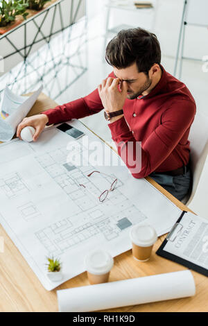Headache, architecture and businessman in office on laptop for project ...