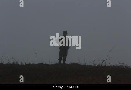 A Karen National Union (KNU) soldier seen on guard after the ceremony ...