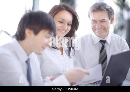 closeup. business team discussing a new contract Stock Photo - Alamy