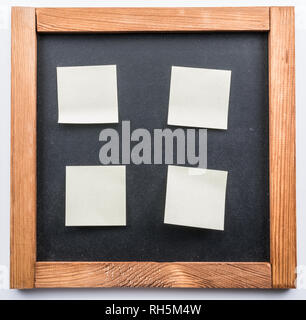 Blackboard and post-it notes stuck to the front Stock Photo - Alamy