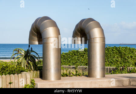 Two big air pipes for drain-ventilation on the sidewalk of the beach ...