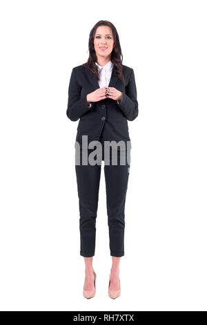 Confident business woman standing with steeple hand gesture ready for ...