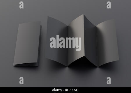 Blank black folded paper leaflet on wooden background. Eight pages ...