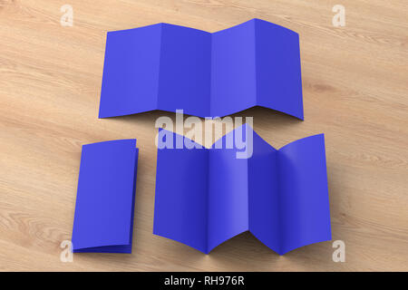 Blank blue folded paper leaflet on black background. Eight pages, four ...