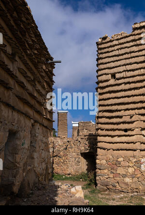 Stone and mud houses and watchtower with slates in al Khalaf village ...
