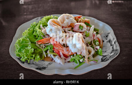 Seafood appetizer. Octopus salad cooking process. Mediterranean ...