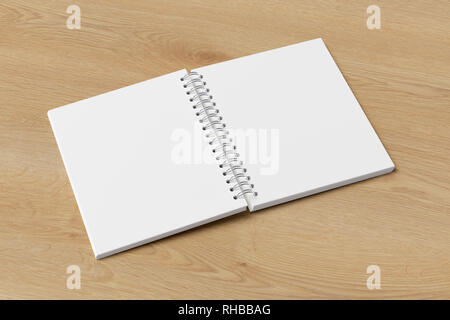 Blank open vertical spiral notepad on wooden background. With clipping ...