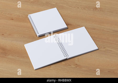 Blank open and closed square spiral notepad on white background. With ...