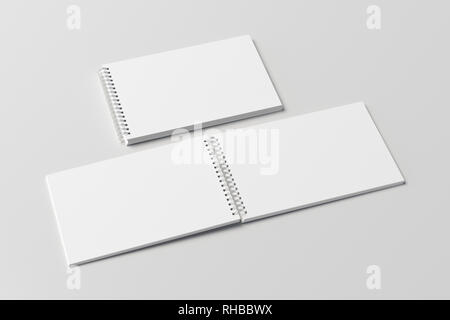 Blank open and closed horizontal spiral notepads on white background ...
