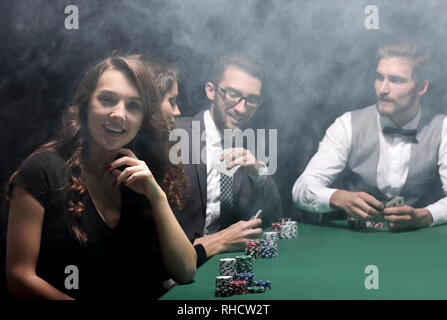 modern business woman sitting at craps table in a casino Stock Photo ...