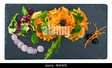 Tasty fried vegetarian carrots cutlets with greens served at plate ...