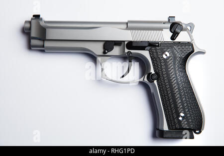 Stainless steel 9mm Pistol with magazine Stock Photo - Alamy