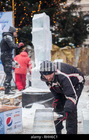 Ukraine, Lviv - January 11, 2019: Master makes ice sculptures from ice ...