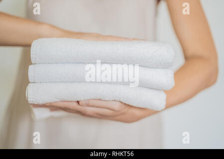 Closeup shot of a blue hotel’s room key card isolated on a wooden ...