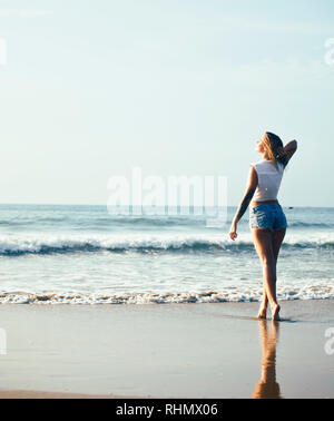 young pretty blond woman at seacoast walking relaxing, fashion lady at ...