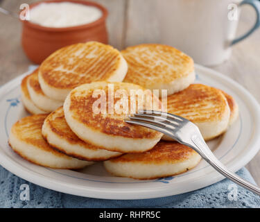 Traditional Russian dish for breakfast syrniki. Cottage cheese pancakes ...