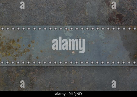 Old metal plate sign with rivets on steel background. With copy space ...