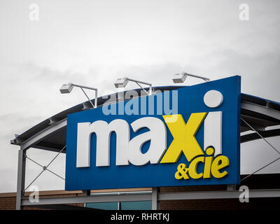 A logo sign outside of a Maxi retail grocery store location in ...