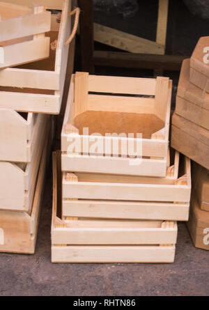 Wooden empty crate boxes for sale in a market place Stock Photo - Alamy