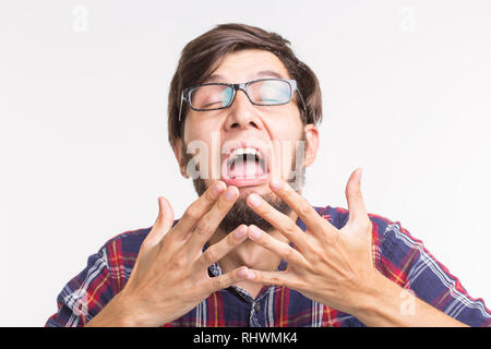 people, feelings and gesture concept - scared man hiding behind his ...