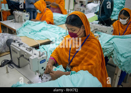 Female workers in a sewing section of a ready-made garment factory in ...