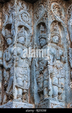 Belur, Karnataka, India : A man and a woman stand next to the 12th ...