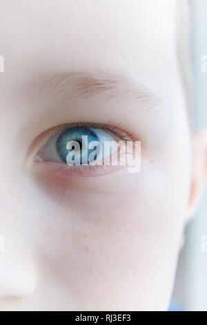 Baby blue beautiful, brooding eyes of a boy Stock Photo - Alamy