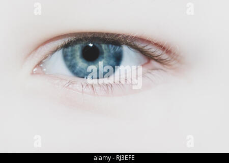 Baby blue beautiful, brooding eyes of a boy Stock Photo - Alamy