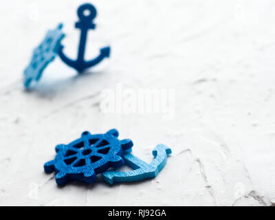 Background with decorative anchors and wheels on a white painted ...