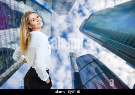 Business woman stands over cityscape background Stock Photo - Alamy